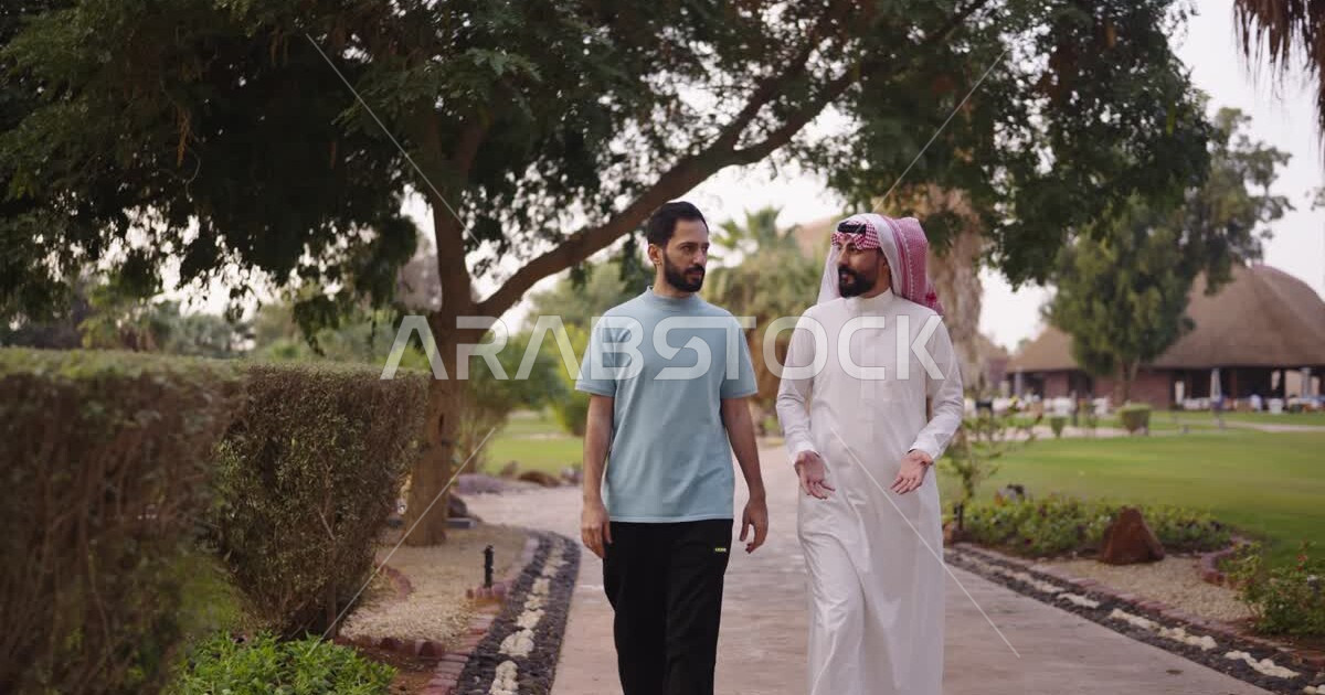 Two Saudi Arabian Gulf men in a recreational resort, parks and ...