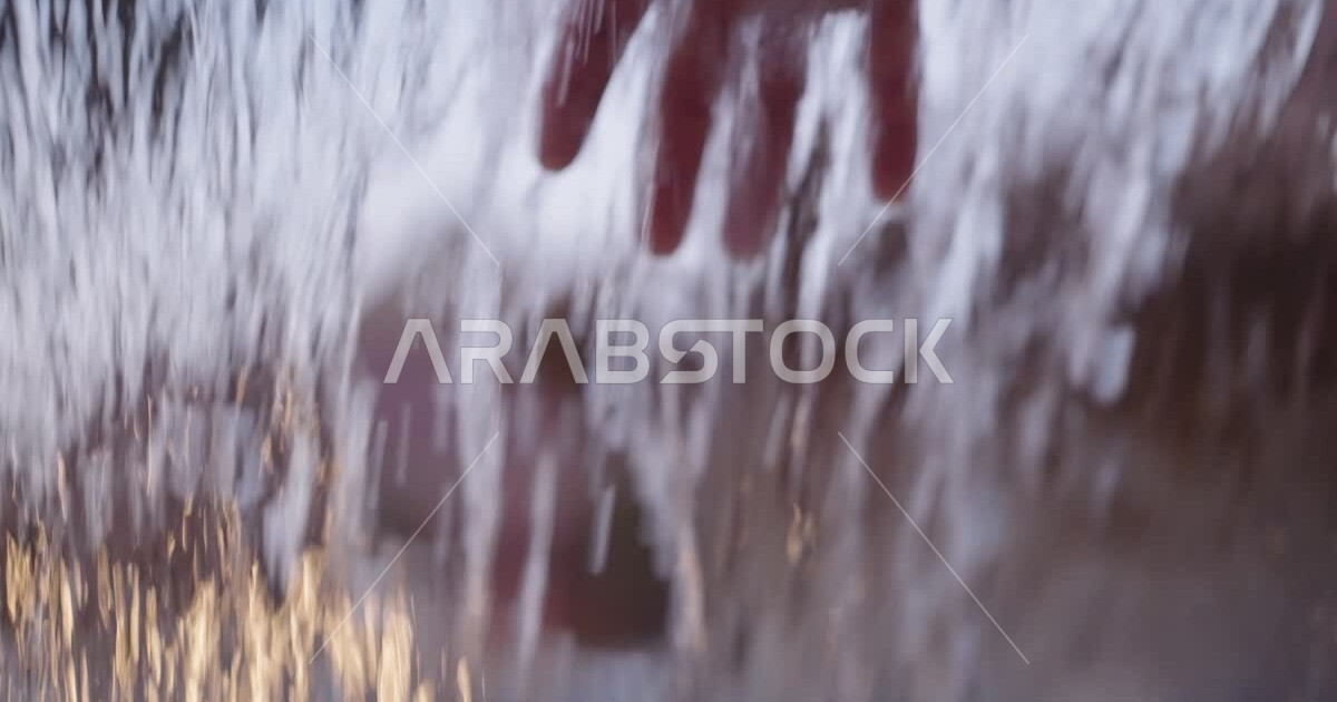 Close-up of a person's hand with water running over it, water flowing ...