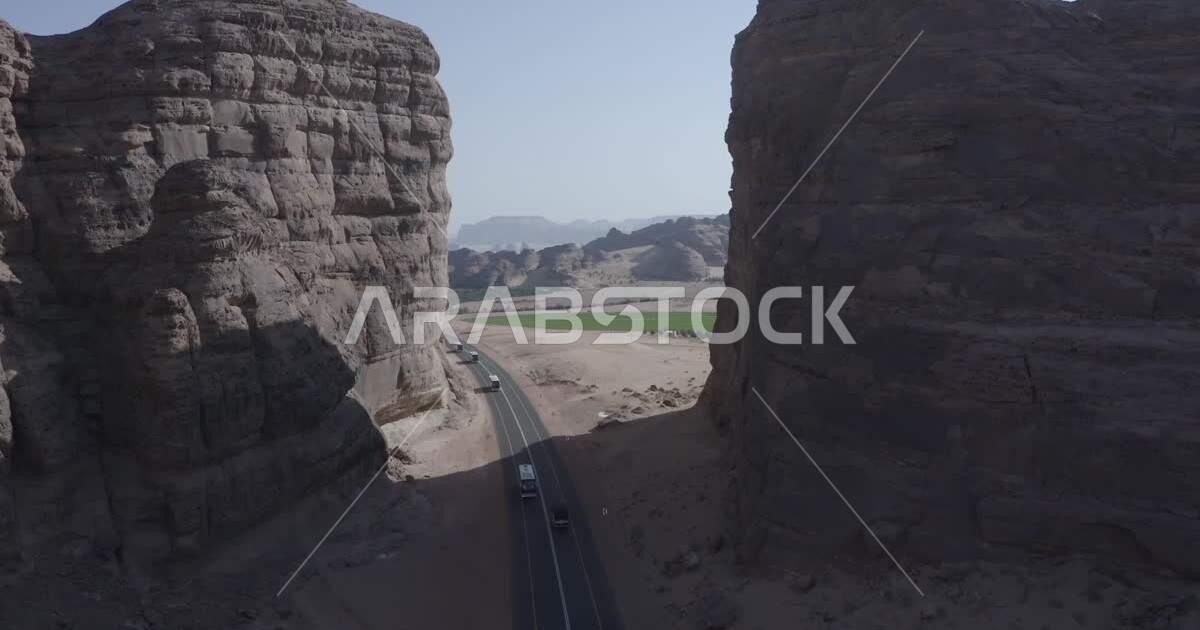 An asphalt road between the mountains and highlands in Al-Ula, Saudi ...