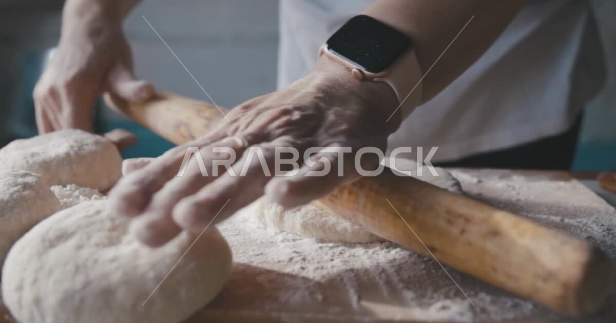 Close-up of a man making bread, pastry, kitchen and dough tools, dough ...