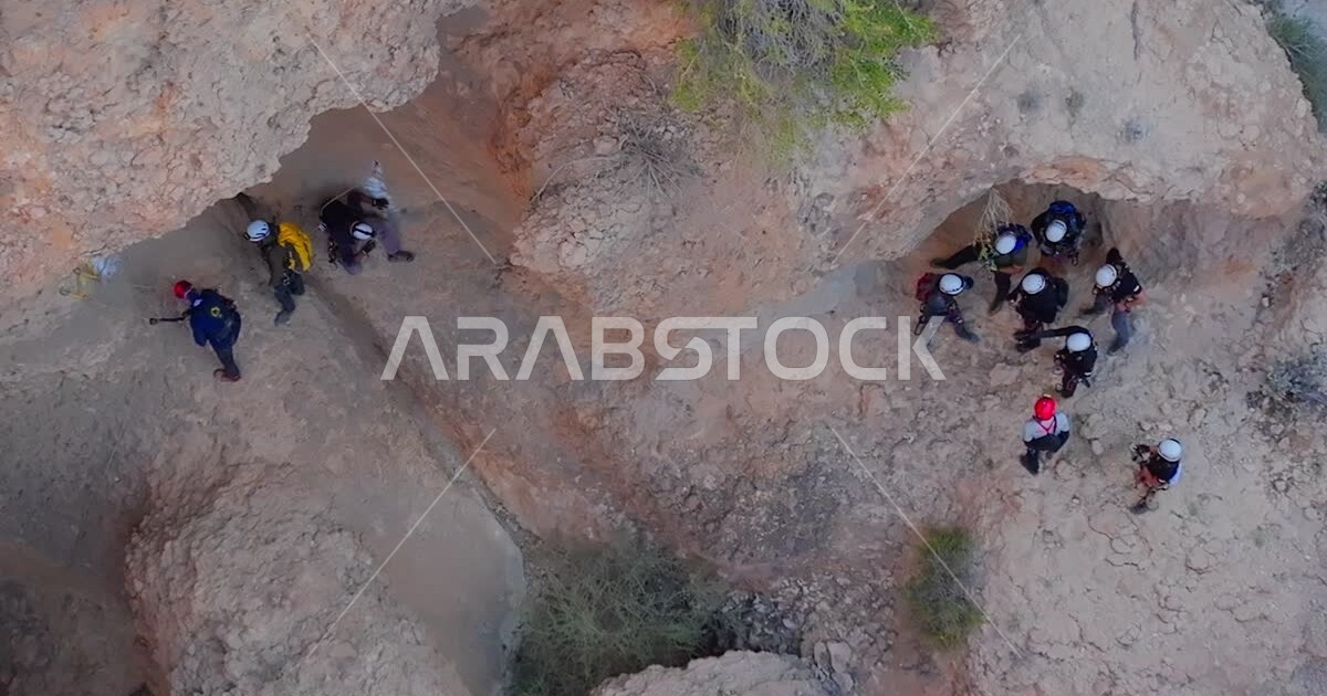 Drone climbers preparing to descend the Majlis al-Jinn cave, the second ...