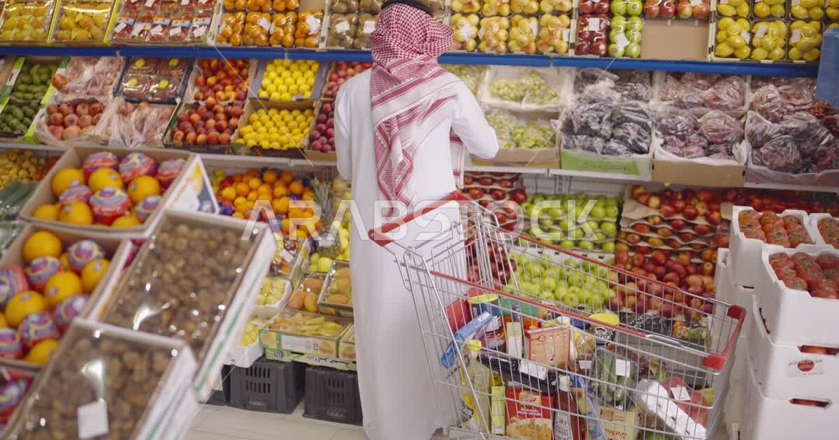 A Saudi Arabian Gulf man buys fruits from the supermarket, the fruit ...