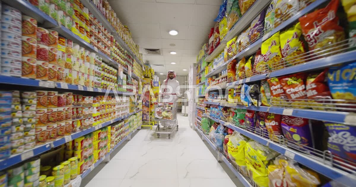 A Saudi Arabian Gulf man shopping in the supermarket, the pleasure of ...