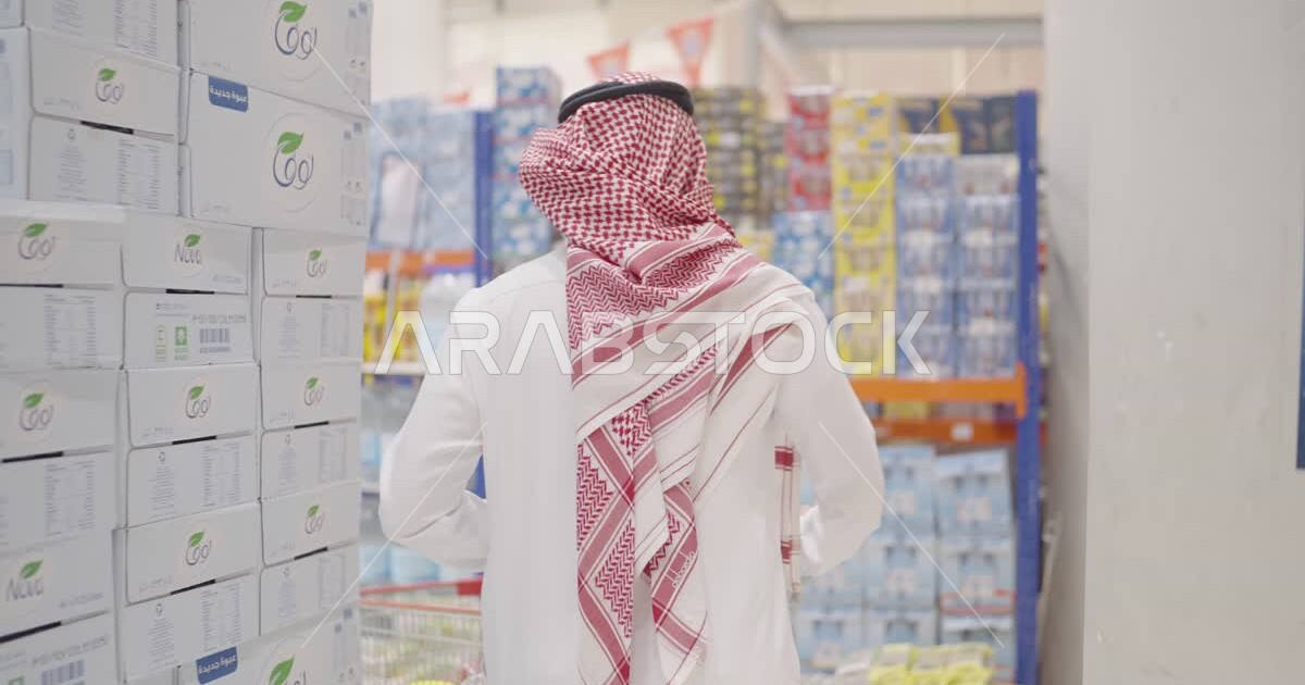 Photography from the back of a Saudi Arabian Gulf man wandering inside ...