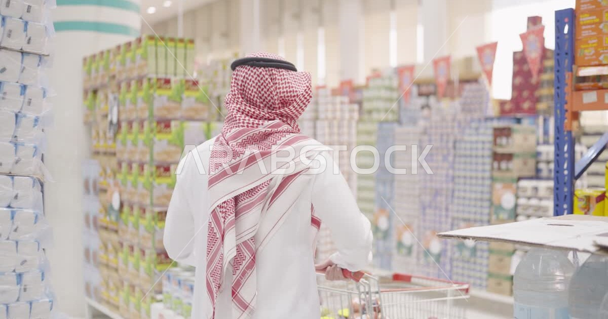 Photography from the back of a Saudi Arabian Gulf man wandering inside ...