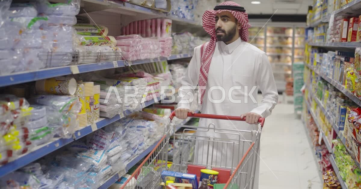 An Arab Gulf man shopping in the household items section of the ...